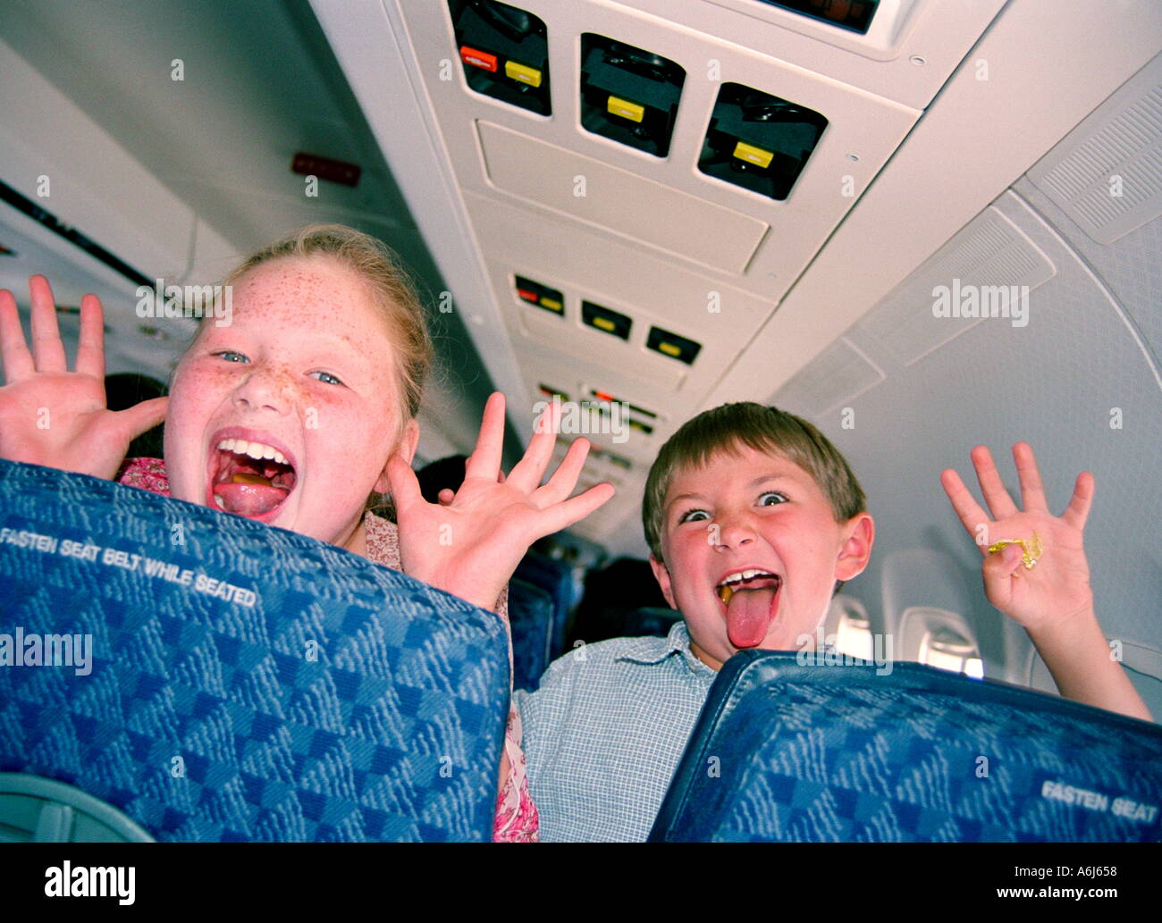 Little Kids Having Fun on an Airplane Stock Photo - Alamy