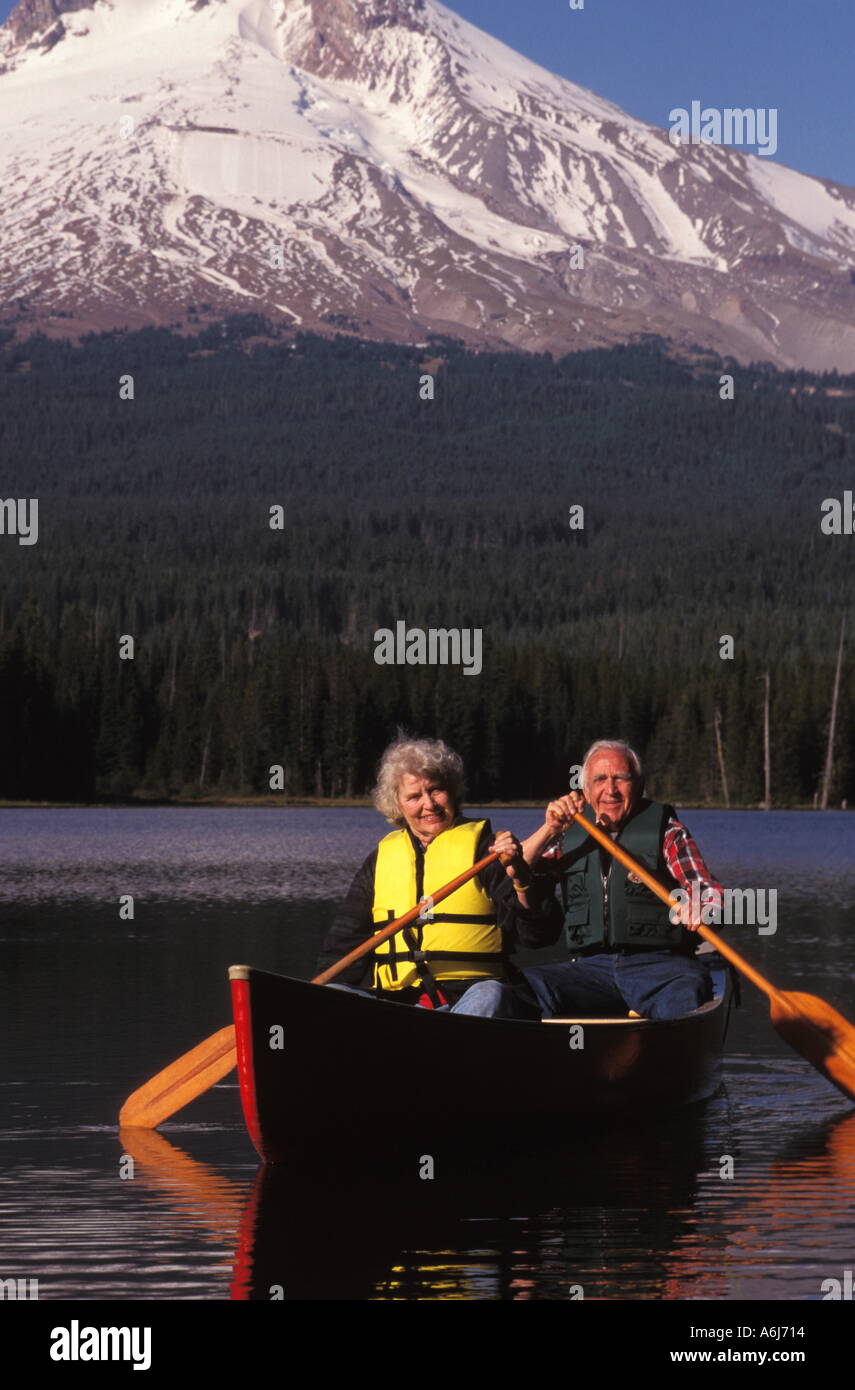 Senior couple paddling canoe hi-res stock photography and images - Alamy