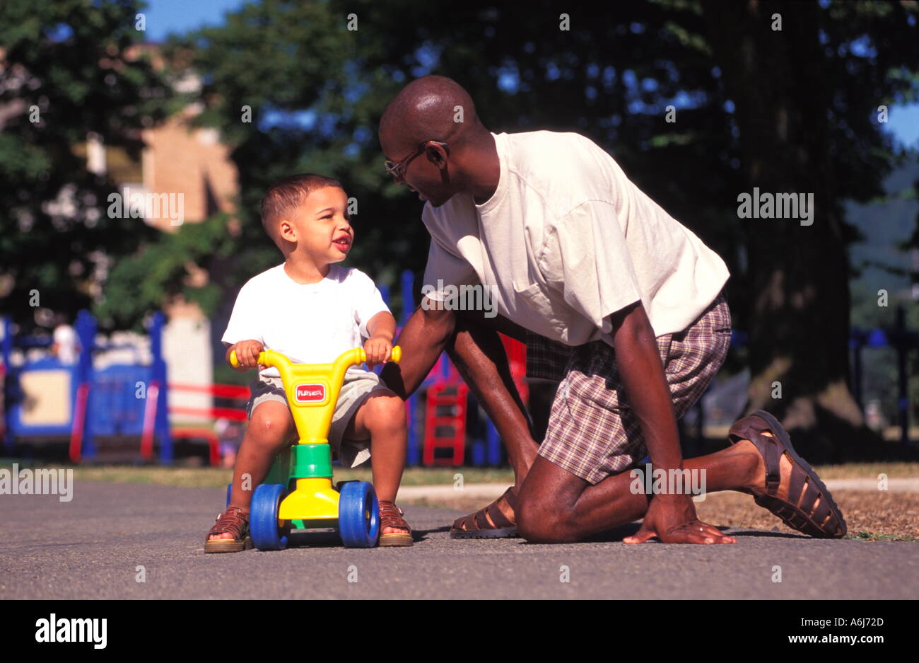 Father and Son in Playground Stock Photo - Alamy