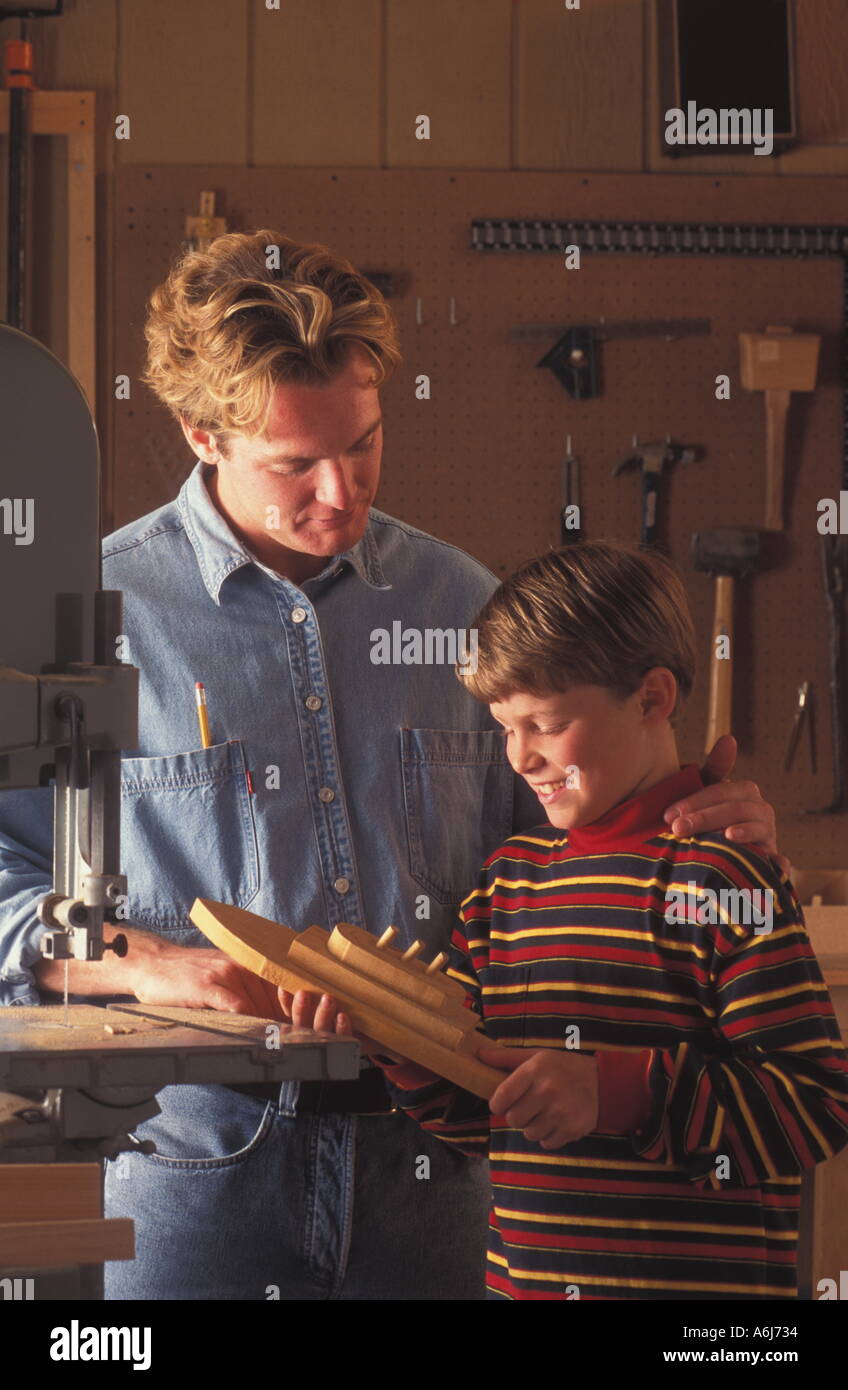 Father and Son Working in Woodshop Stock Photo - Alamy