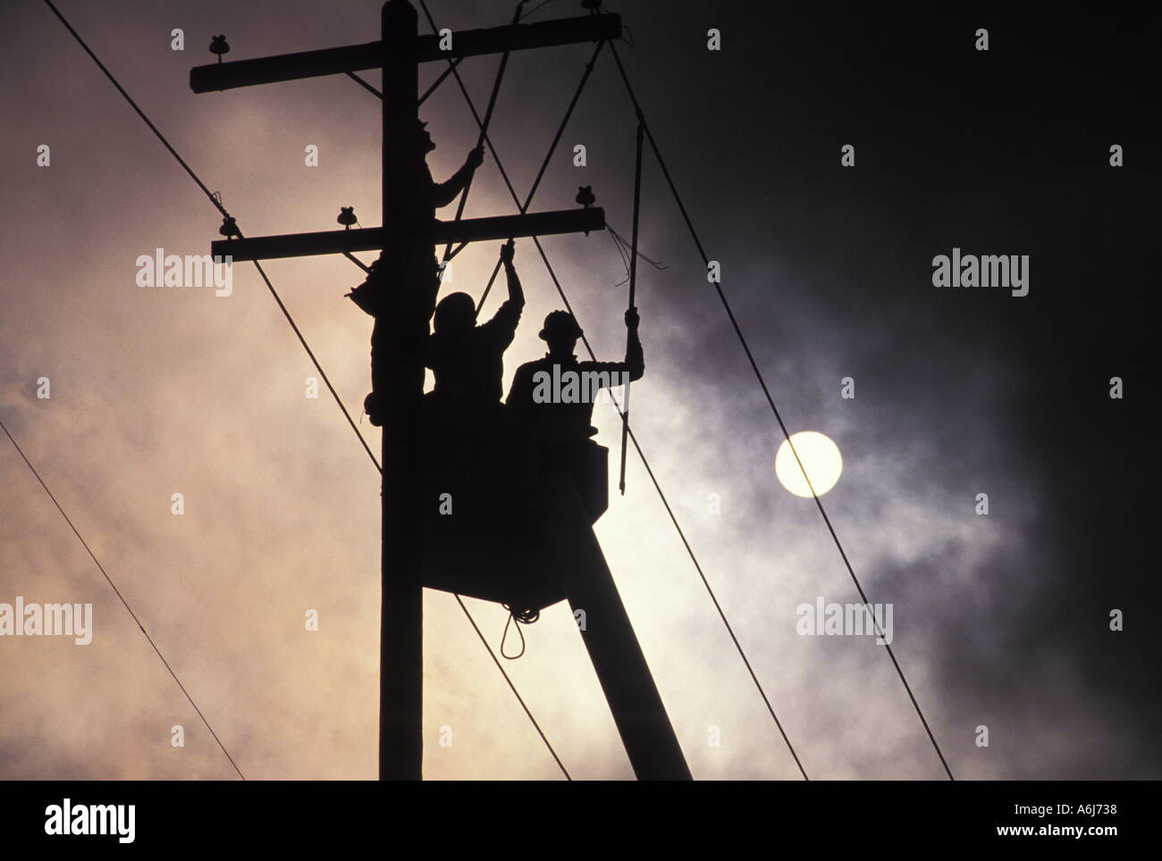 Workers Fixing a Telephone Line Stock Photo - Alamy