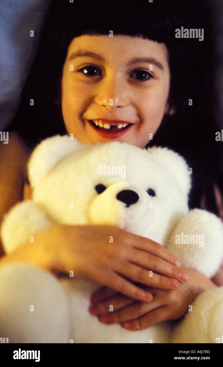 Little Girl Hugging Teddy Bear Stock Photo - Alamy