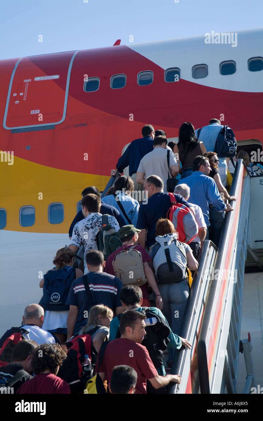 Passengers boarding a plane at Madrid-Barajas Airport, Madrid, Spain ...