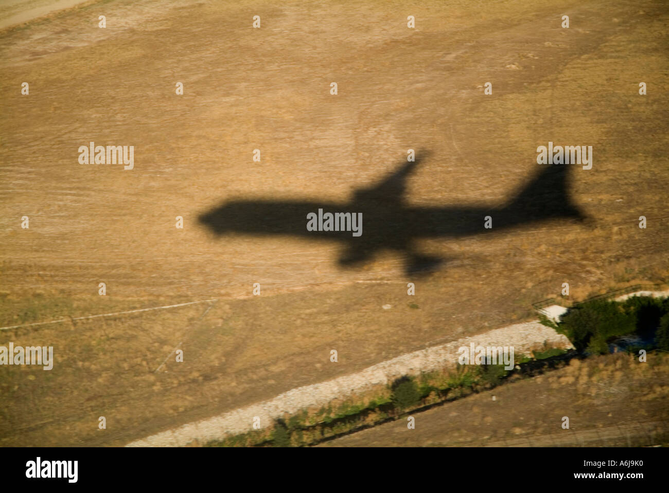 Shadow of a flying airplane taking off Stock Photo - Alamy