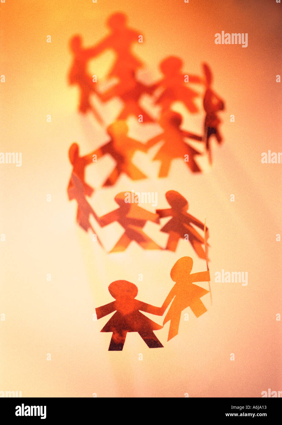 Paper Cut Out People Linked Together Stock Photo - Alamy