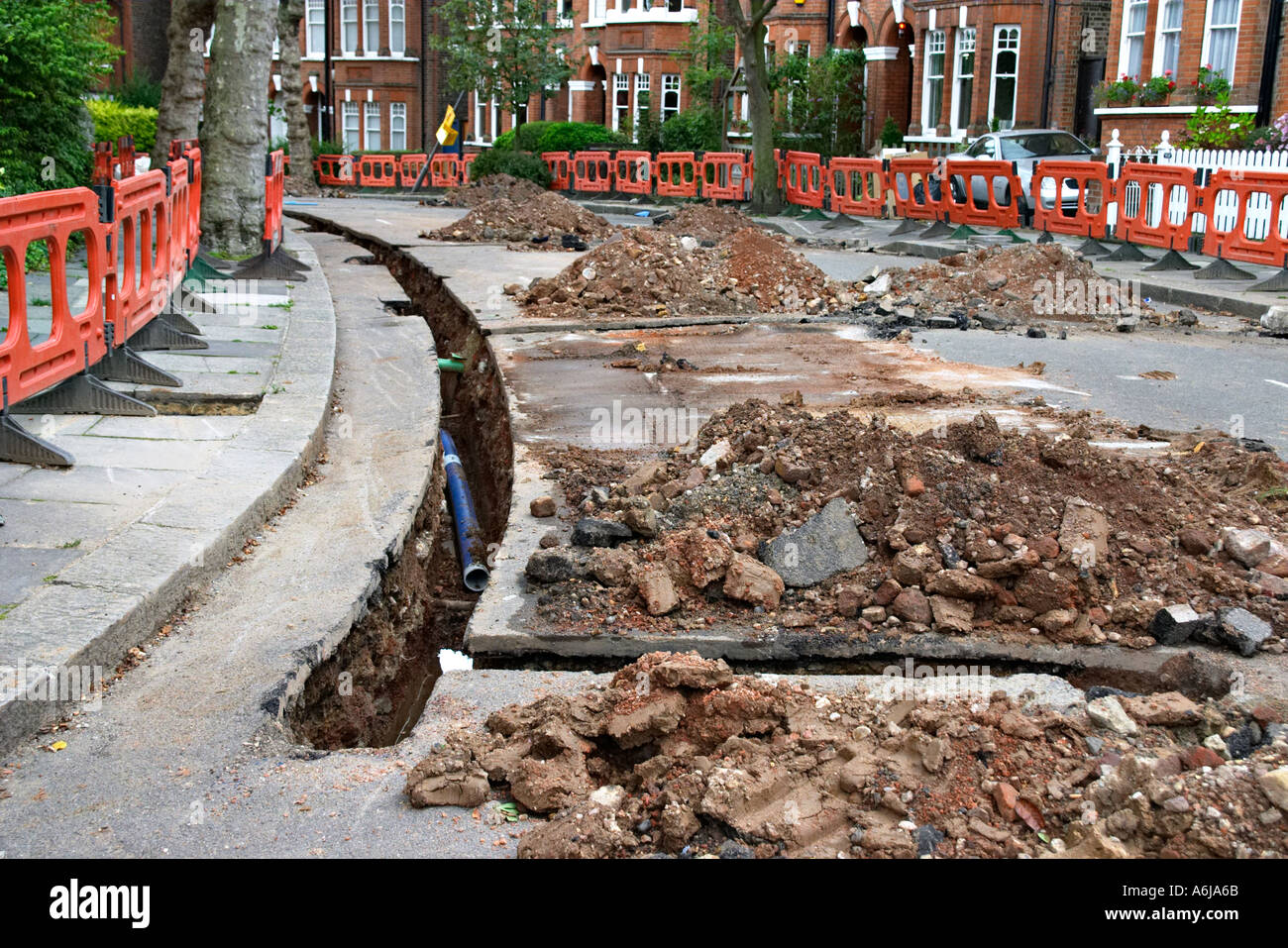 sewer sewerage gas mains water supply road works repair street crater ...