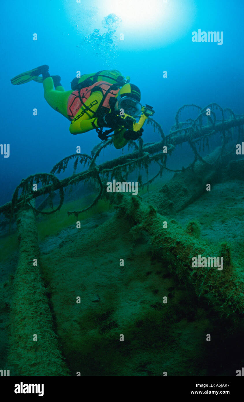 Diving photographer in a clear Mountain lake Stock Photo - Alamy