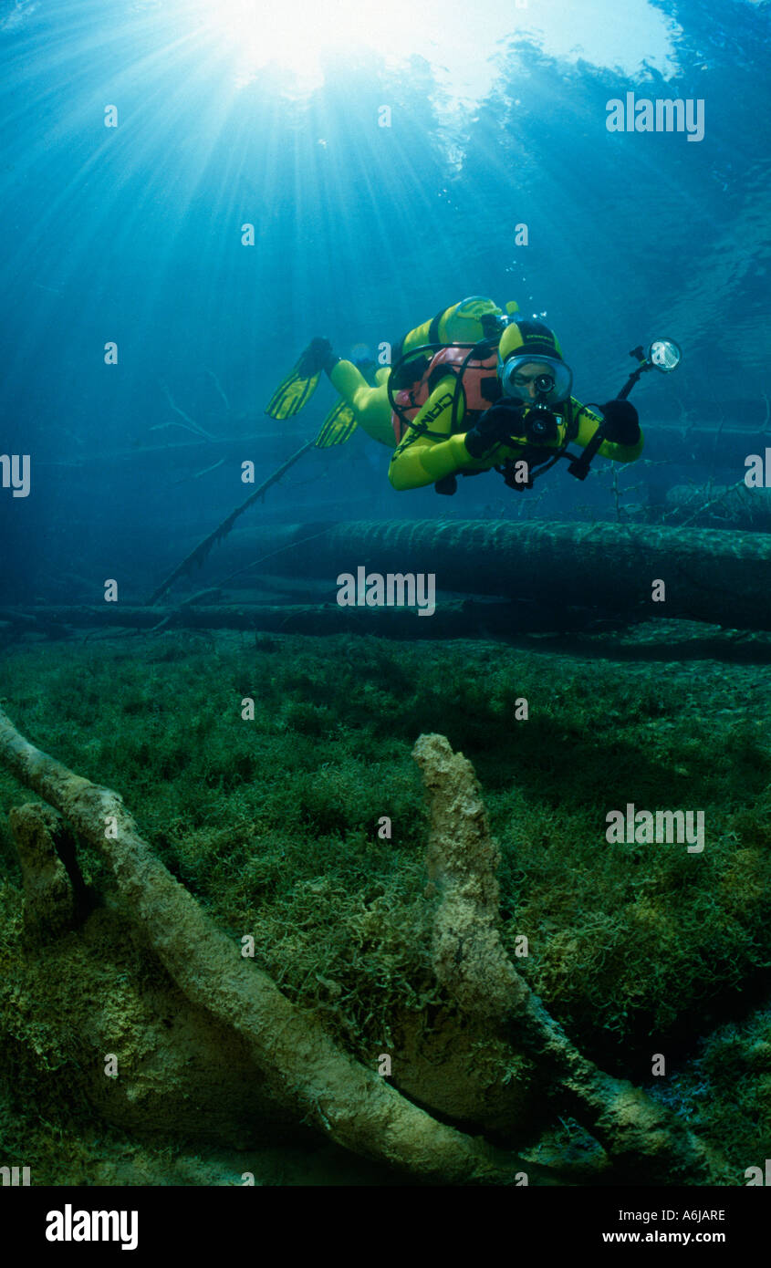 Diving photographer in a clear Mountain lake Stock Photo - Alamy