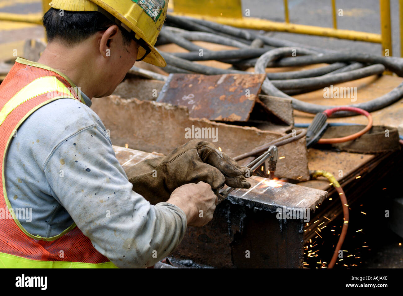 Construction worker welding metal, Hong Kong, China Stock Photo - Alamy