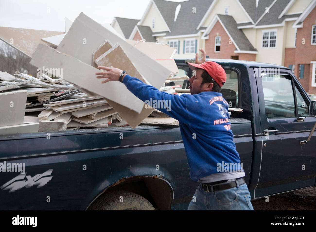 Immigrant Worker Cleaning Drywall Debris Building 1 Stock Photo - Alamy