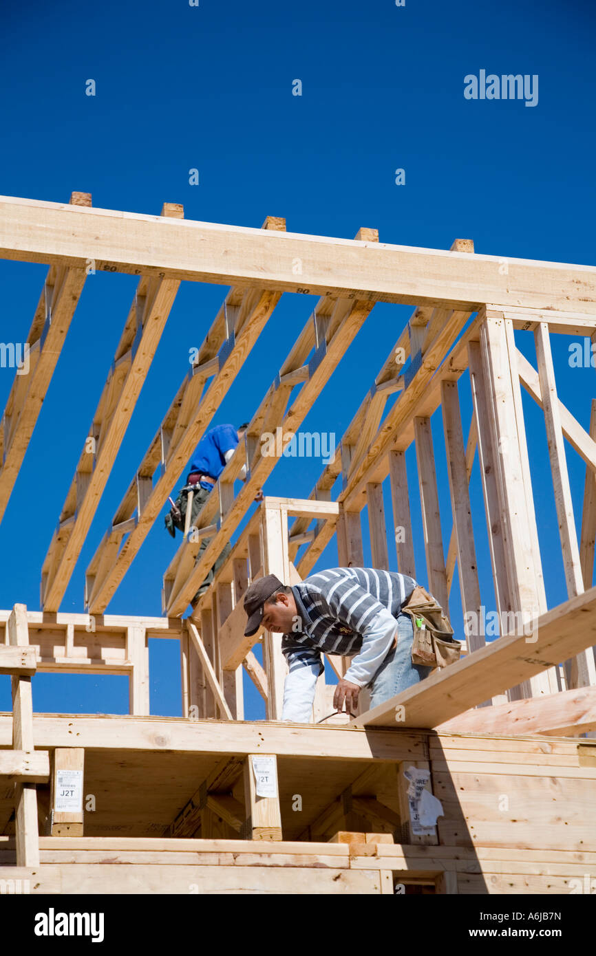 Immigrant Worker Framing Walls Building 3 Stock Photo - Alamy