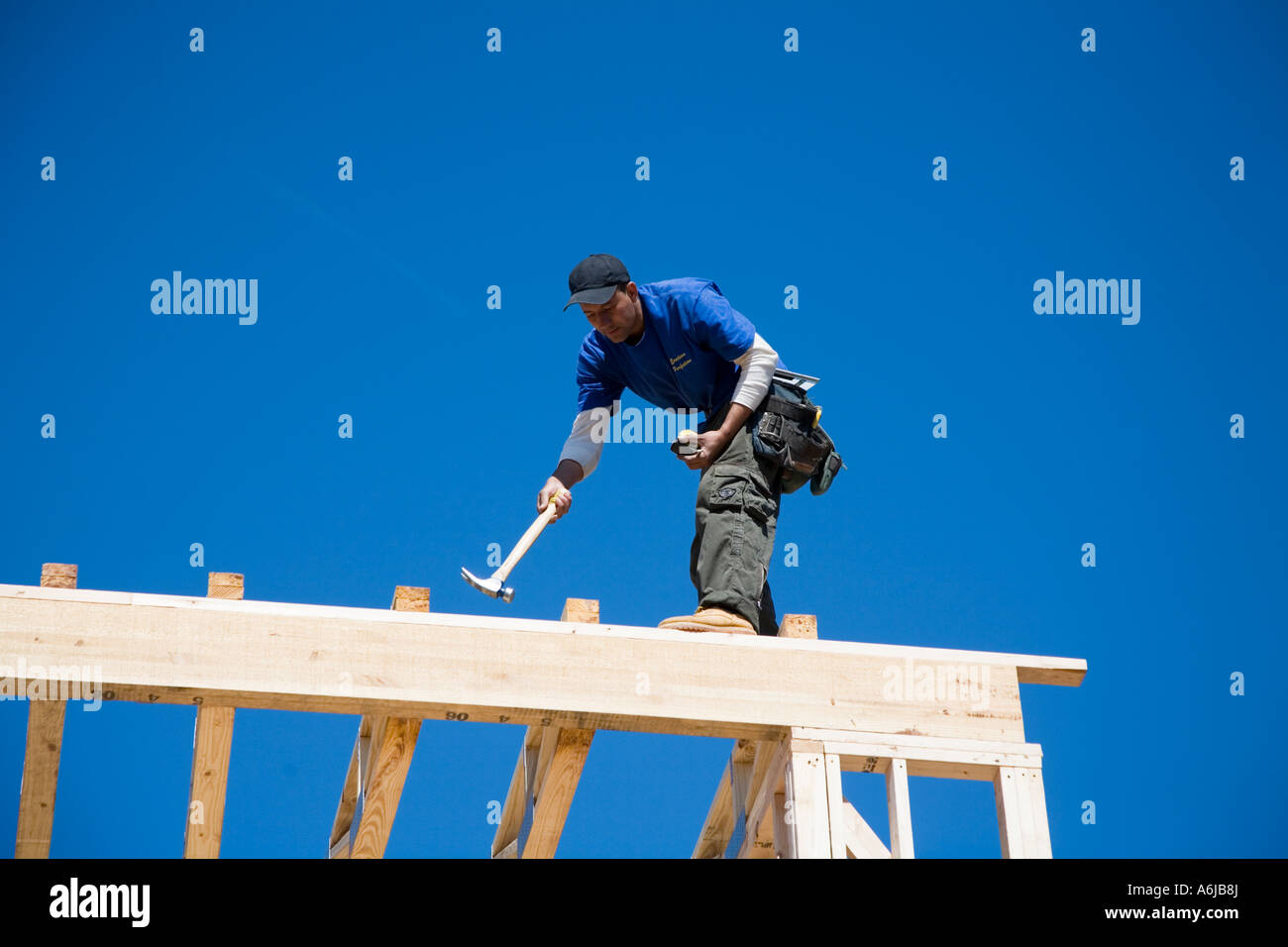 Immigrant Worker Framing Walls Building 3 Stock Photo - Alamy