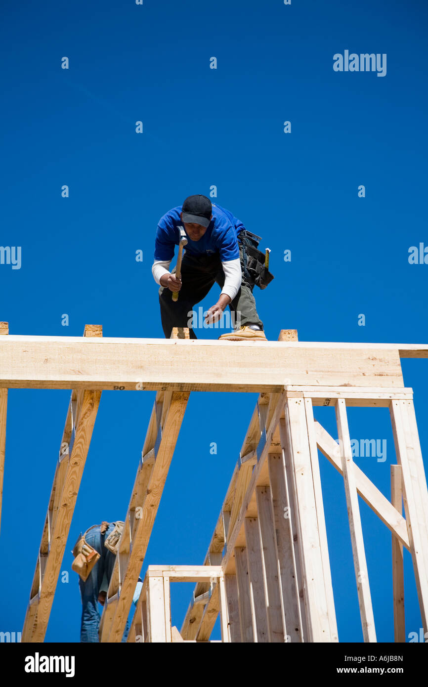Immigrant Worker Framing Walls Building 3 Stock Photo - Alamy