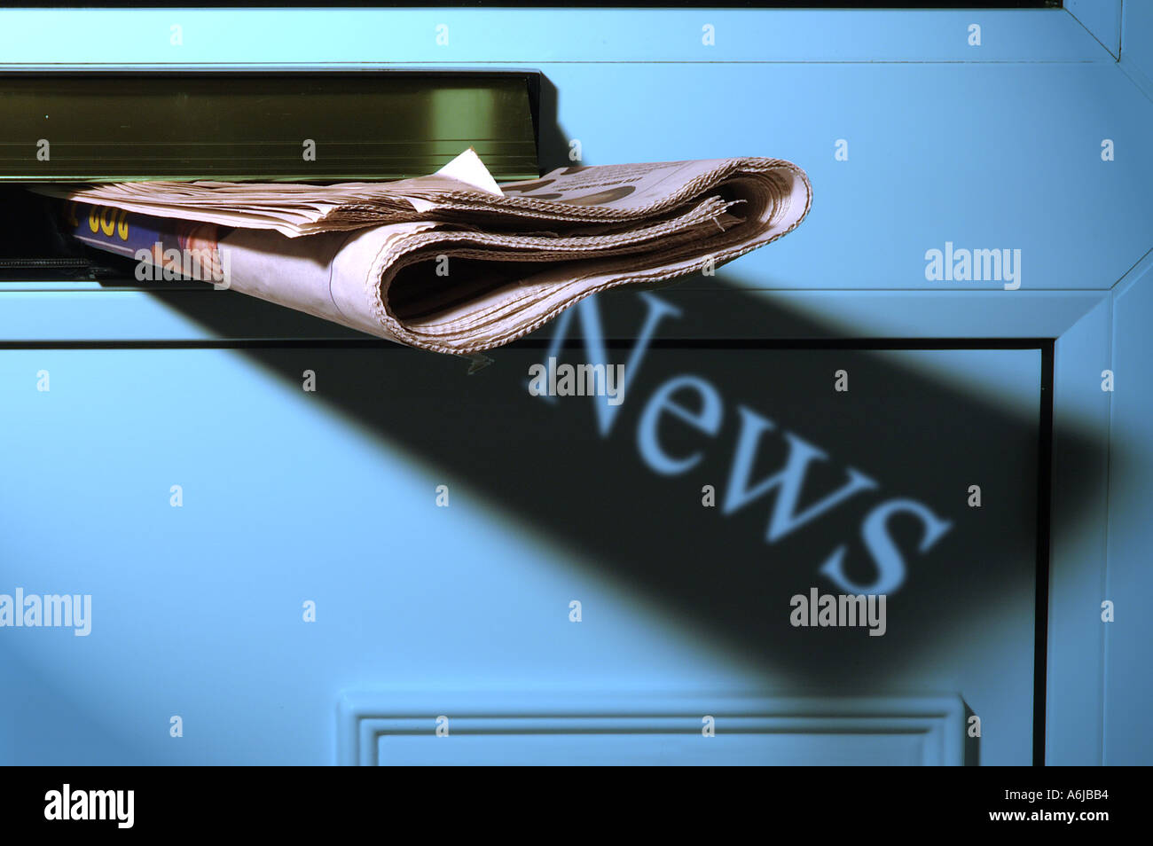 Newspaper with news shadow Stock Photo - Alamy