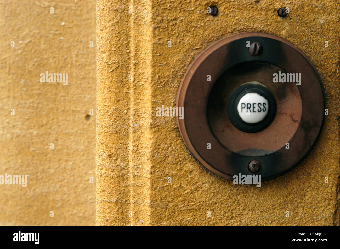 Old bell push marked press set into stone wall Stock Photo - Alamy
