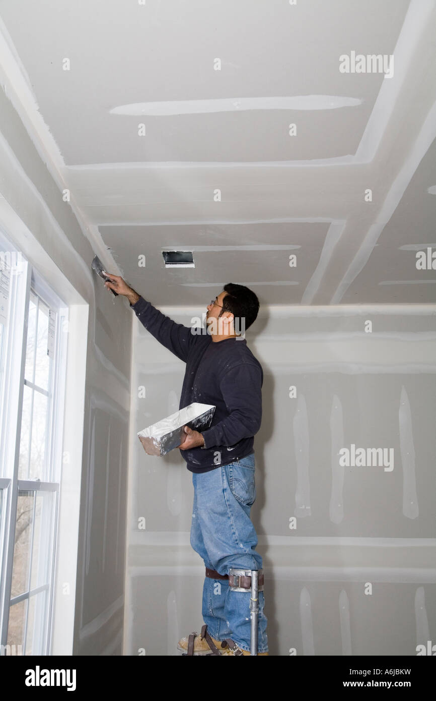 Immigrant Worker Applying Drywall Joint Compound Building 1 Stock Photo ...