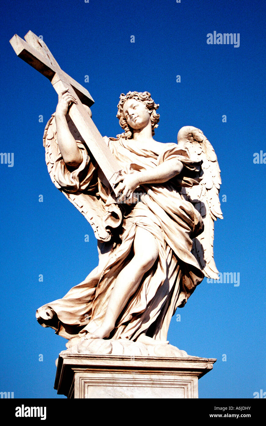 Statue of an angel holding a cross, Rome, Italy Stock Photo - Alamy