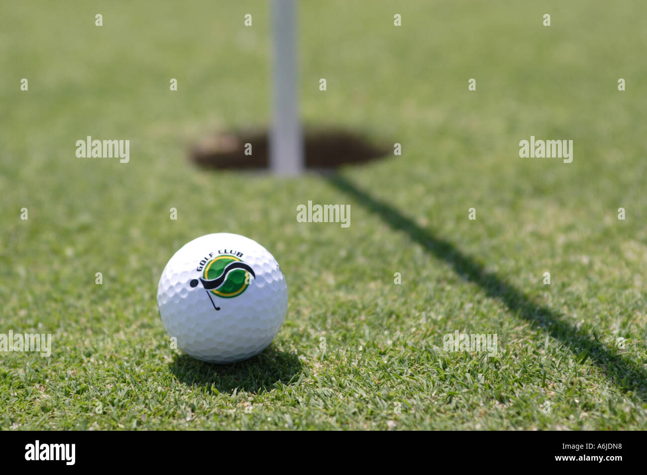 golf ball at golf course at hole Stock Photo - Alamy