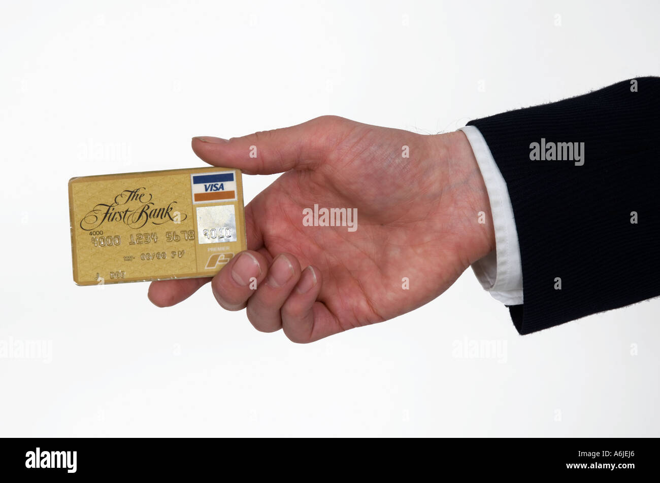 hand with a credit card gold card visa Stock Photo - Alamy