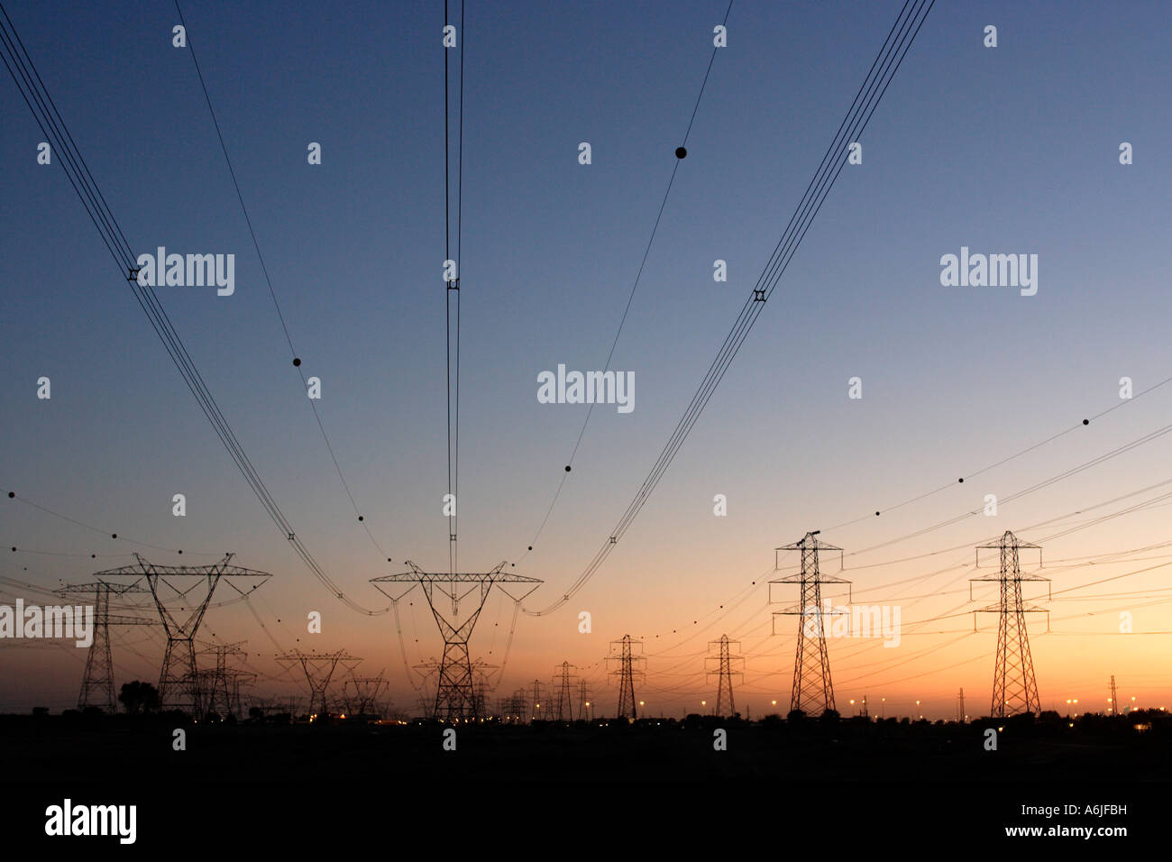 High voltage transmission lines in the evening Stock Photo - Alamy