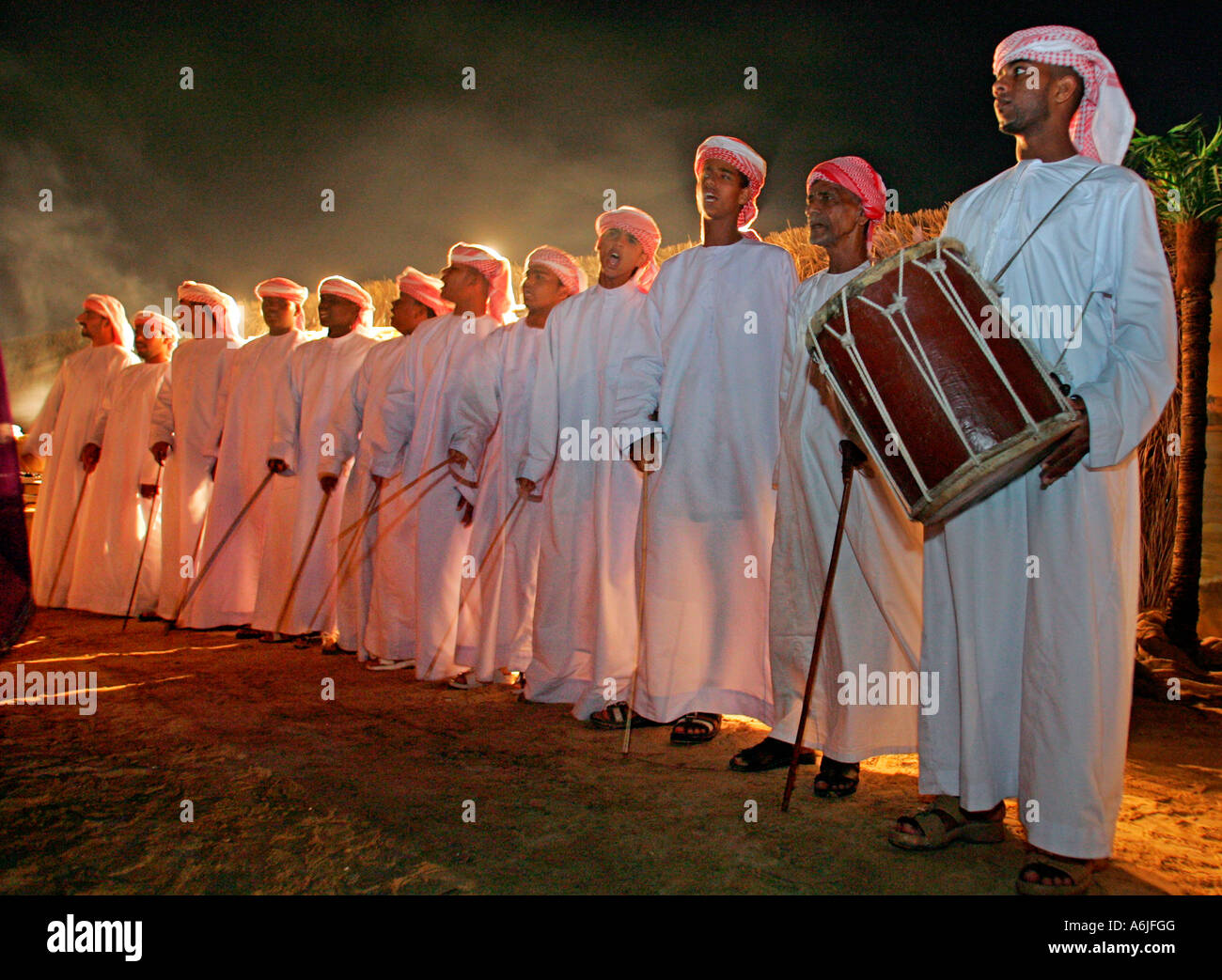 Men in traditional costumes playing drums, Dubai, United Arab Emirates ...