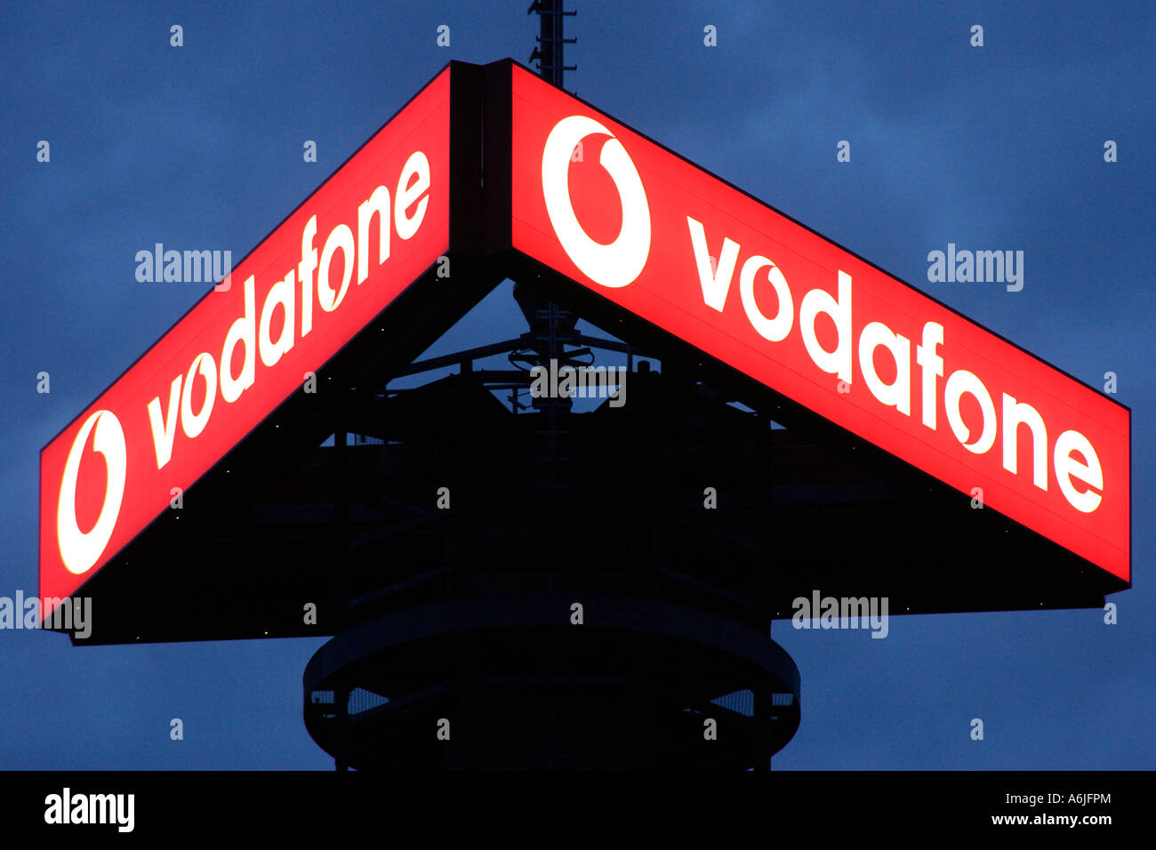 A Vodafone broadcasting tower at night Stock Photo - Alamy