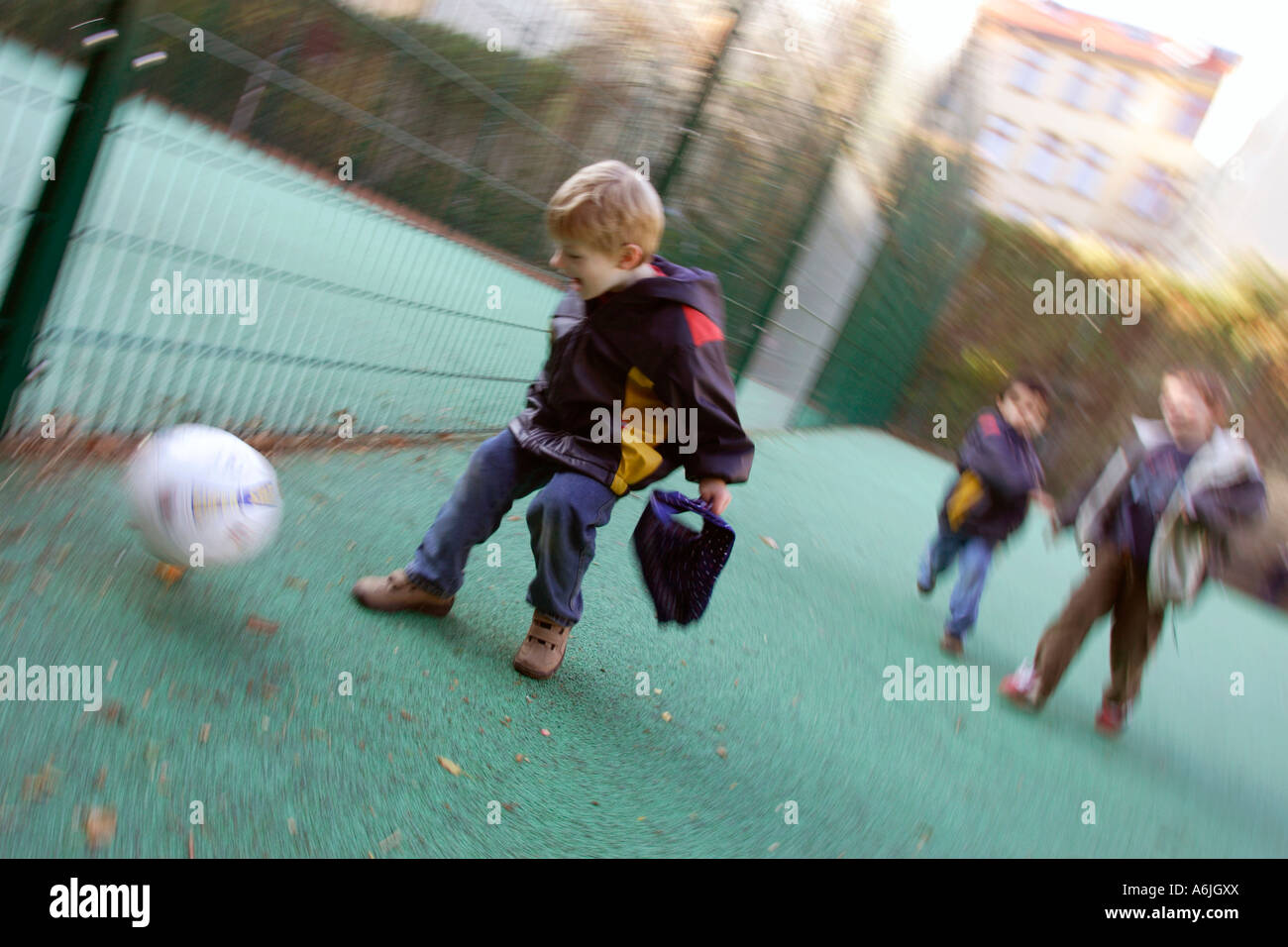 Children playing football berlin germany hi-res stock photography and ...