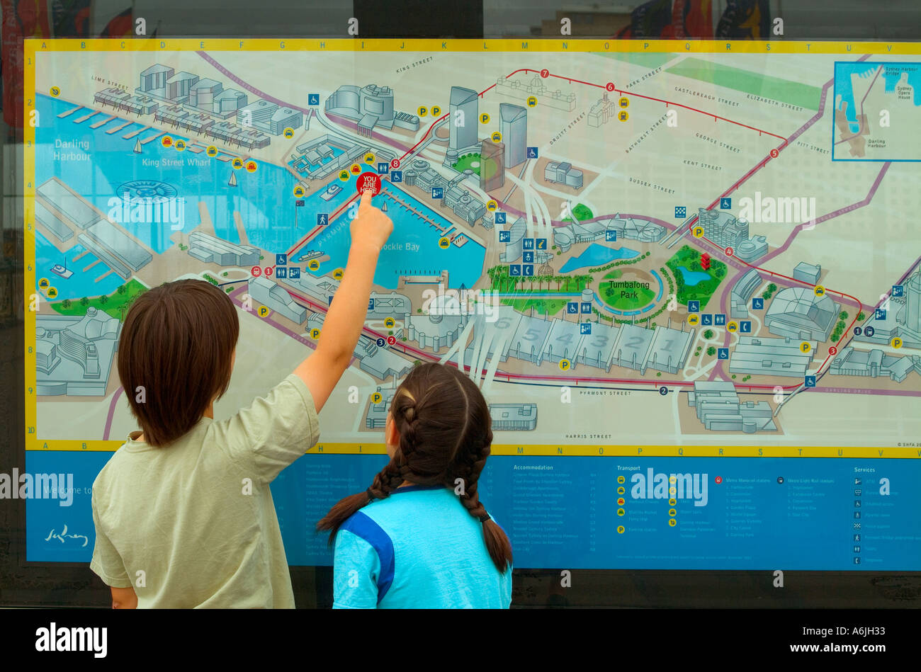 Two children use a city directory map in Sydney, Australia to locate ...