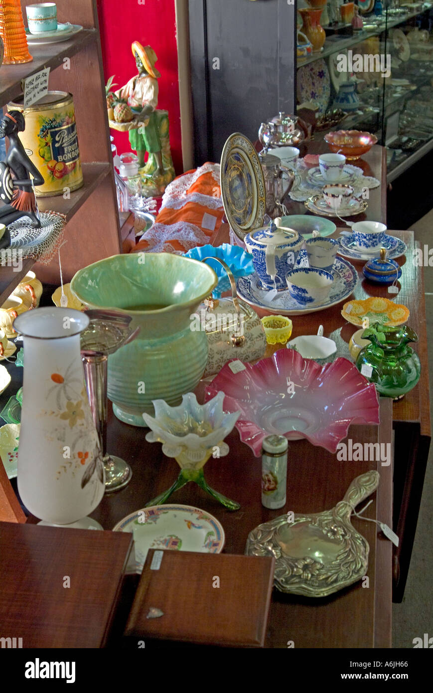 Collection of antique china and glassware in antique shop Stock Photo ...