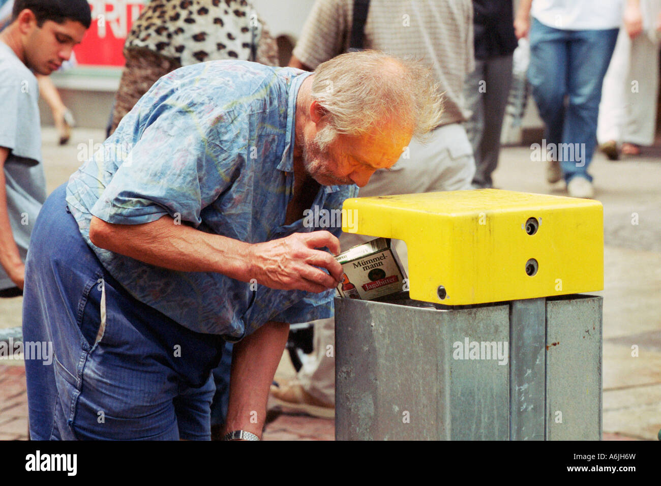 Man digging in a trash can, Stuttgart, Germany Stock Photo - Alamy