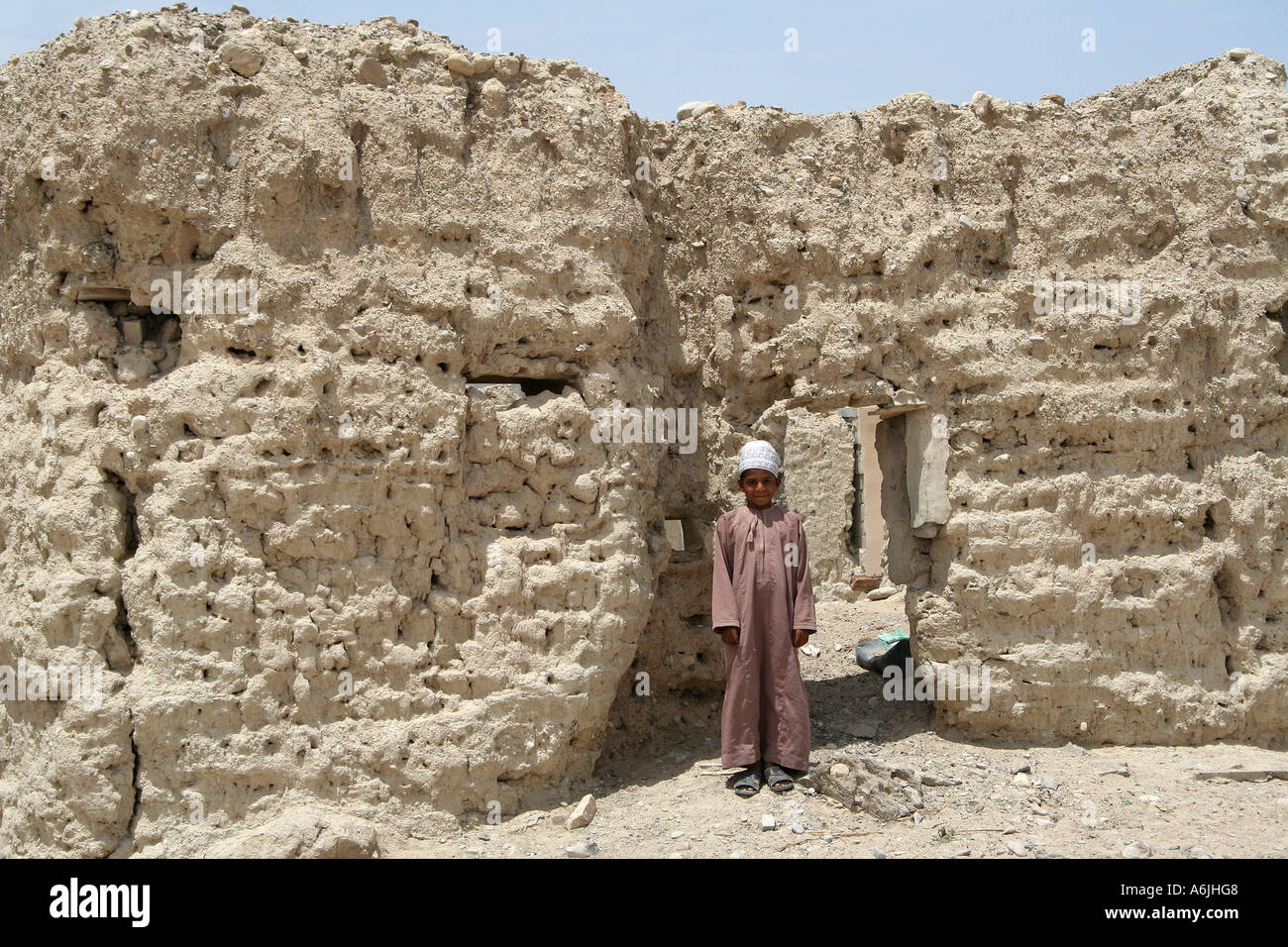 Oman, Ras Al-Hadd Castle, Young boy outside the old fort Stock Photo ...