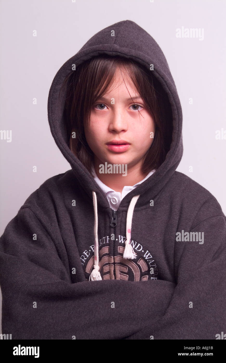 Handsome young 12 year old boy wearing a hoodie Stock Photo - Alamy