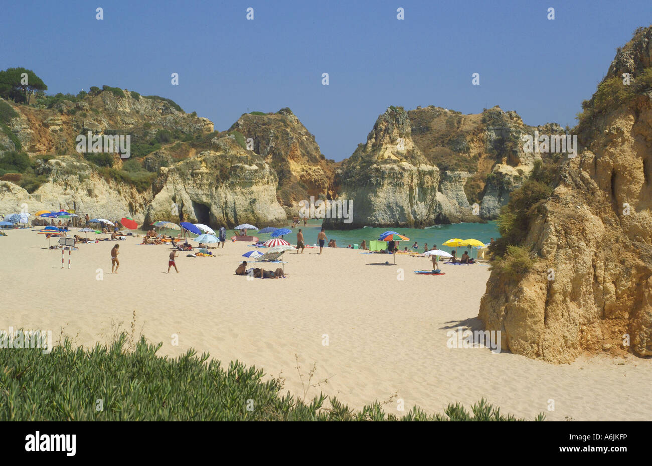 Portugal the Algarve, Praia de Alvor, cove and cliffs in summer ...