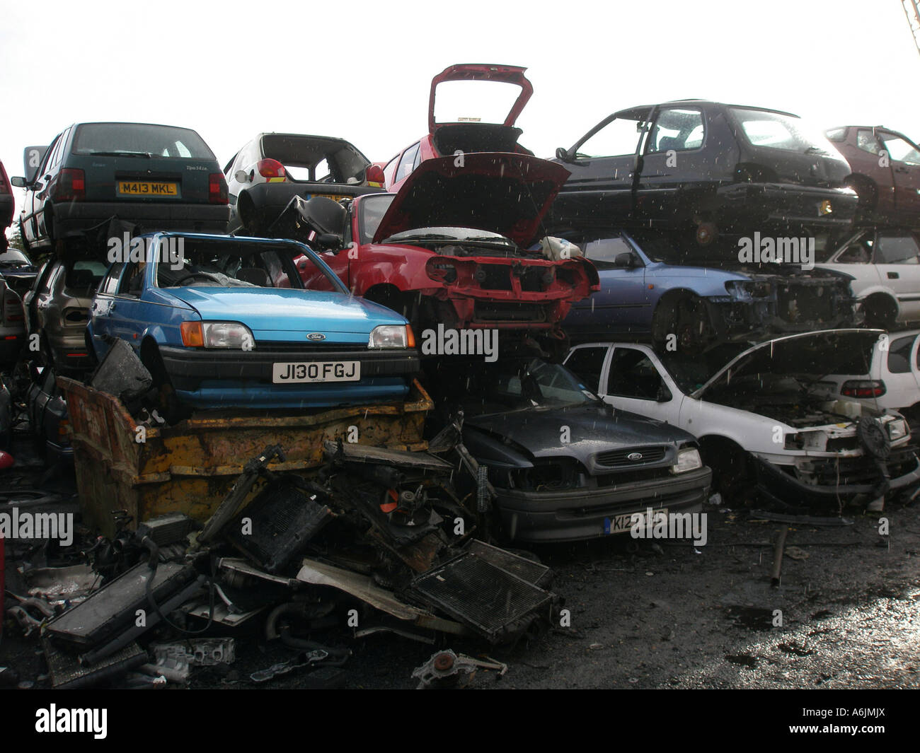 cars stacked up in a scrap yard Stock Photo - Alamy