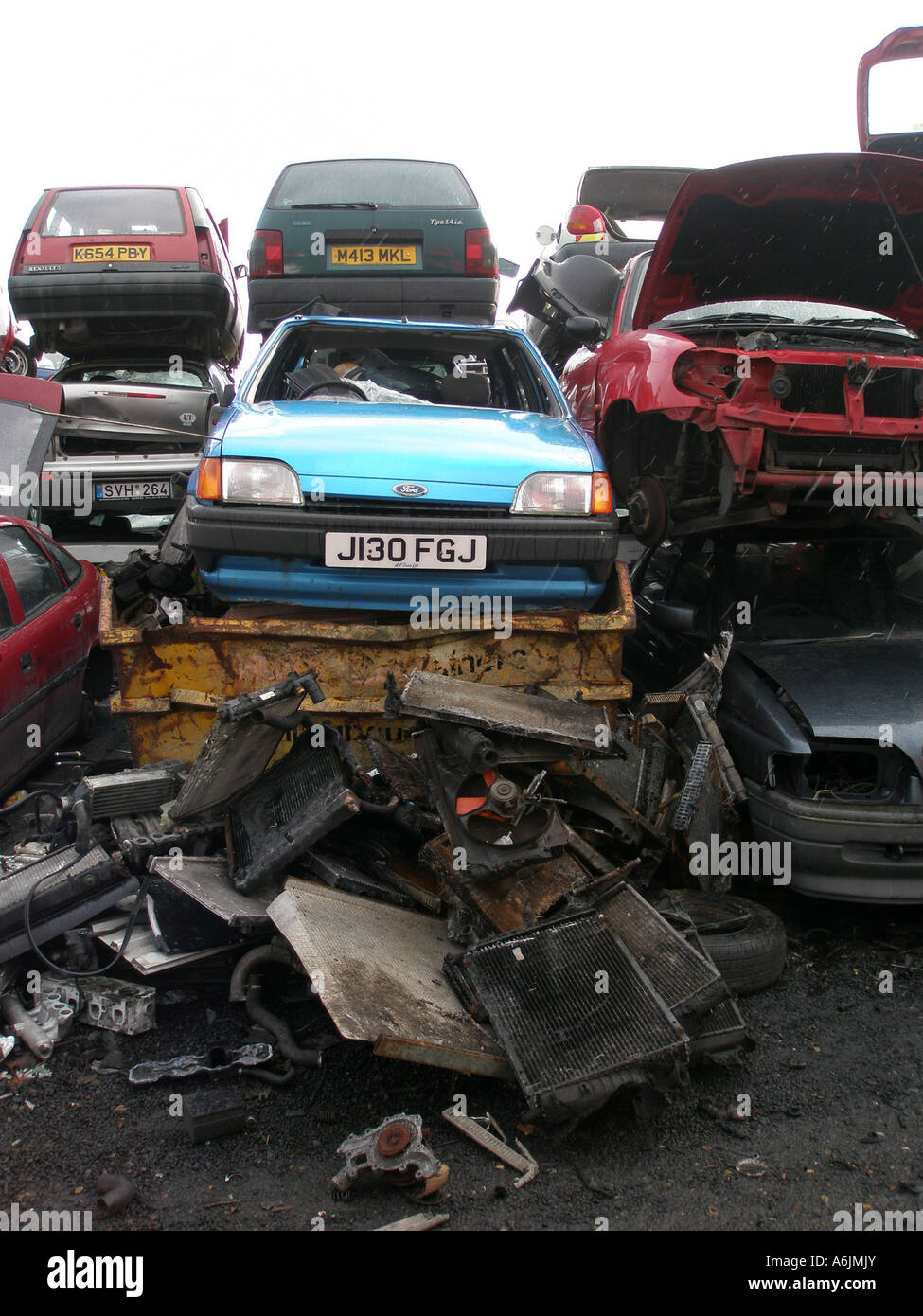 cars stacked up in a scrap yard Stock Photo - Alamy