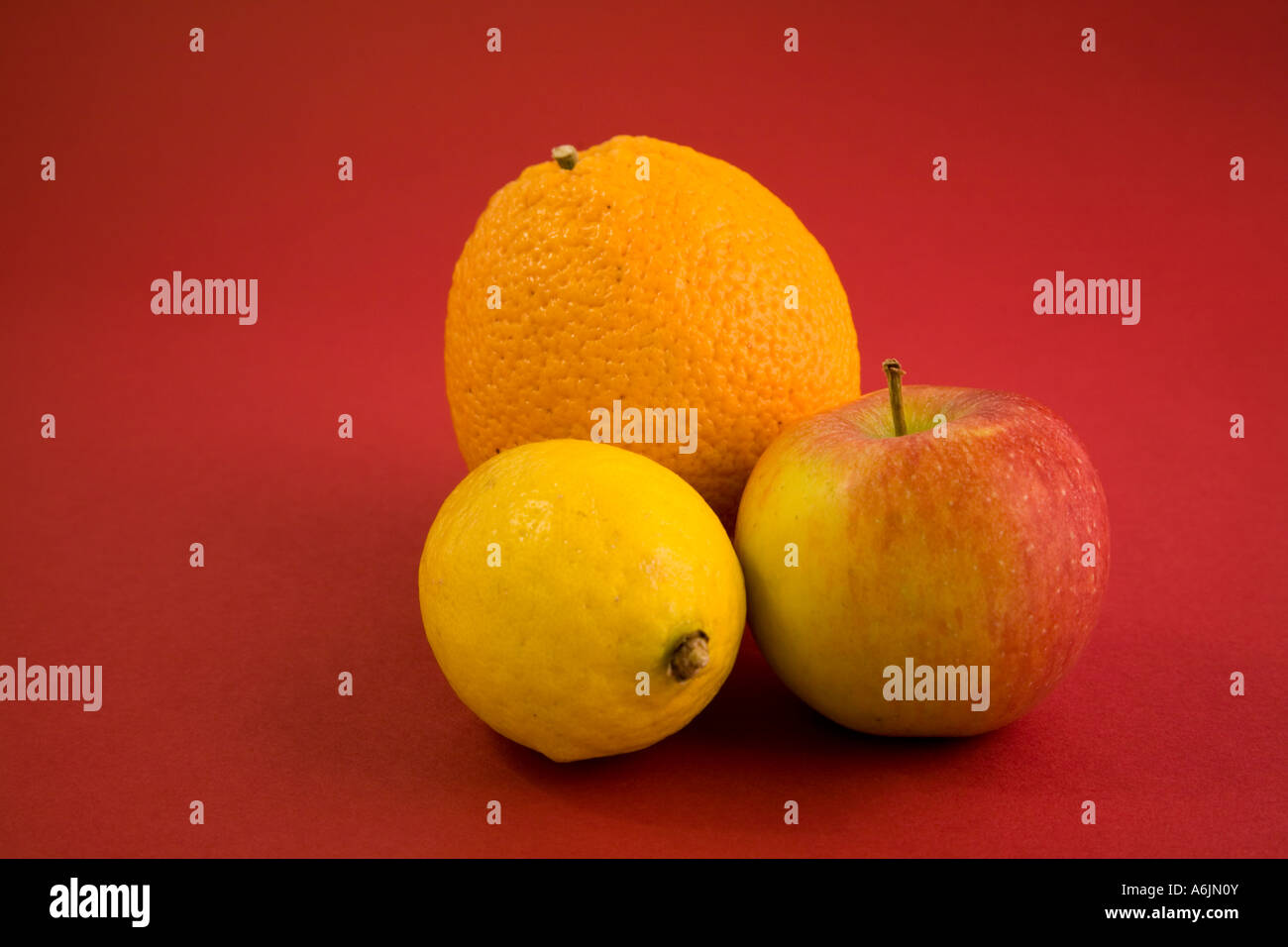 Fruit on a red background Stock Photo - Alamy