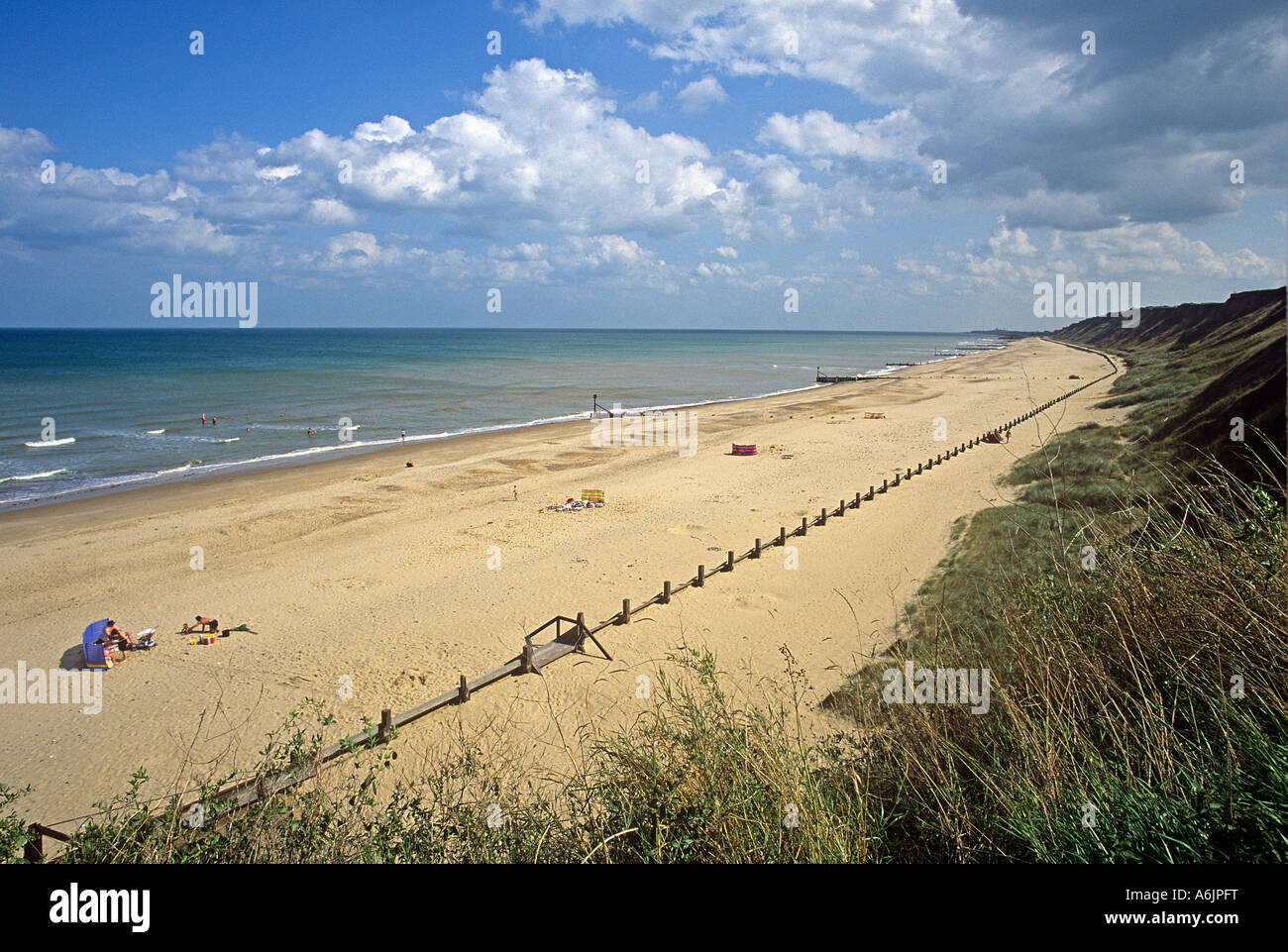 Wide sandy beach at Mundesley below dunes and sloping cliffs on the ...