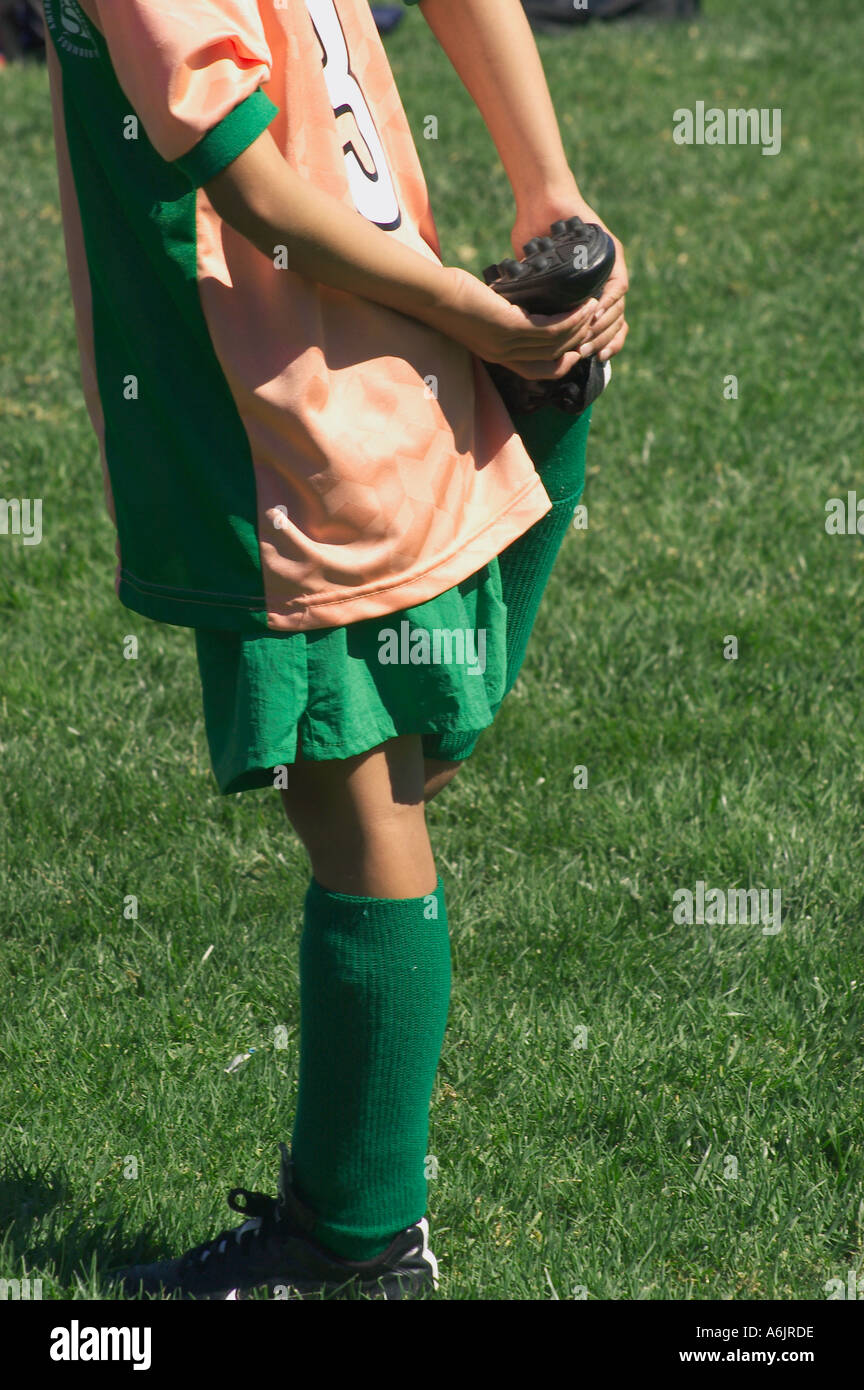 soccer girl stretching Stock Photo - Alamy
