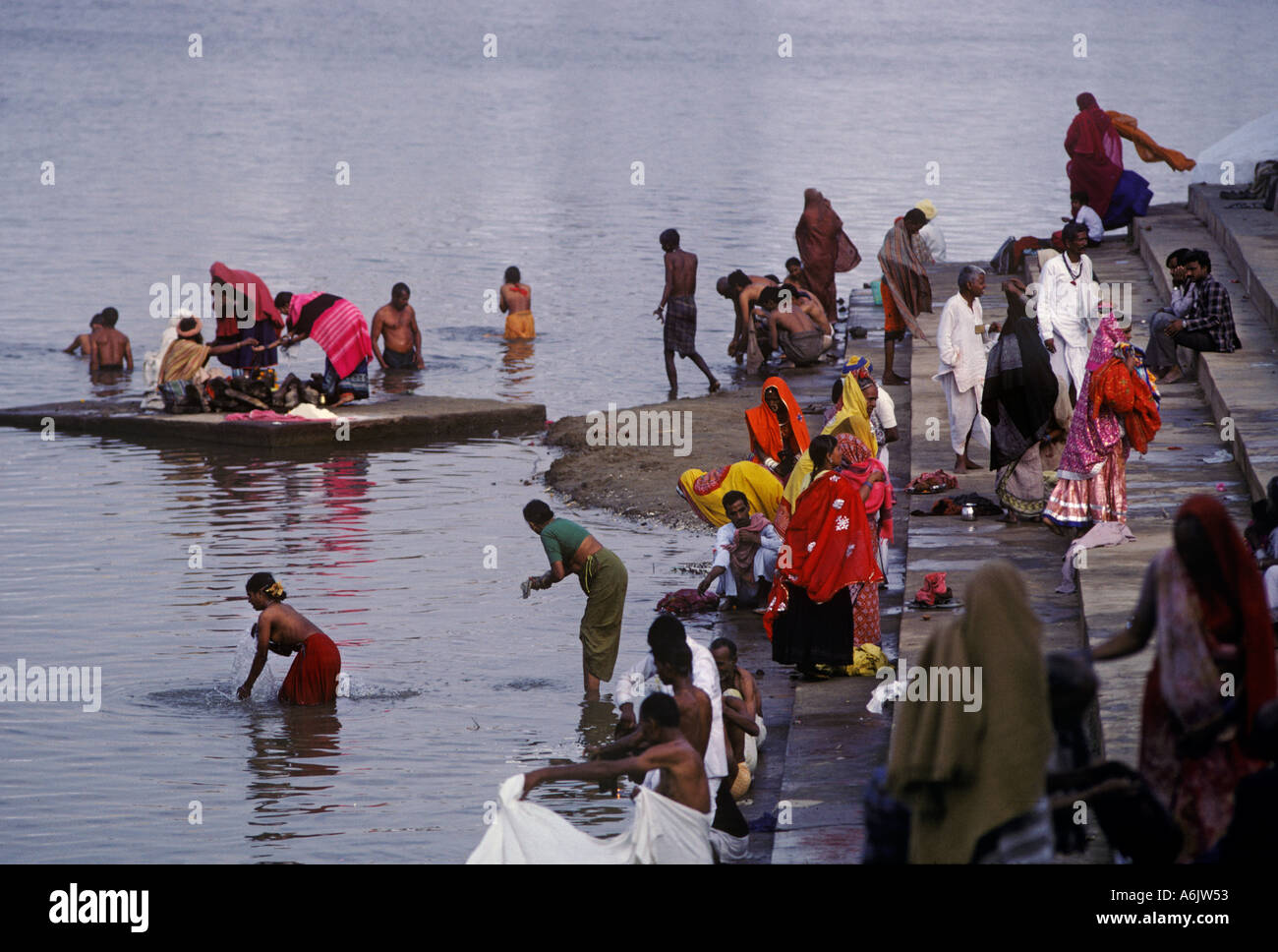 PILGRIMS bathing away their sins at HINDU TEMPLE GHATS on the LAKE at ...