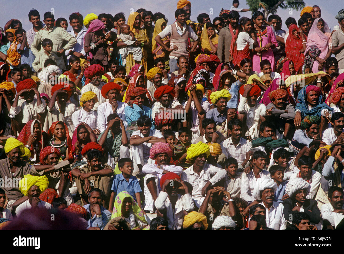 A large CROWD watches the camel races at the PUSHKAR CAMEL FAIR ...