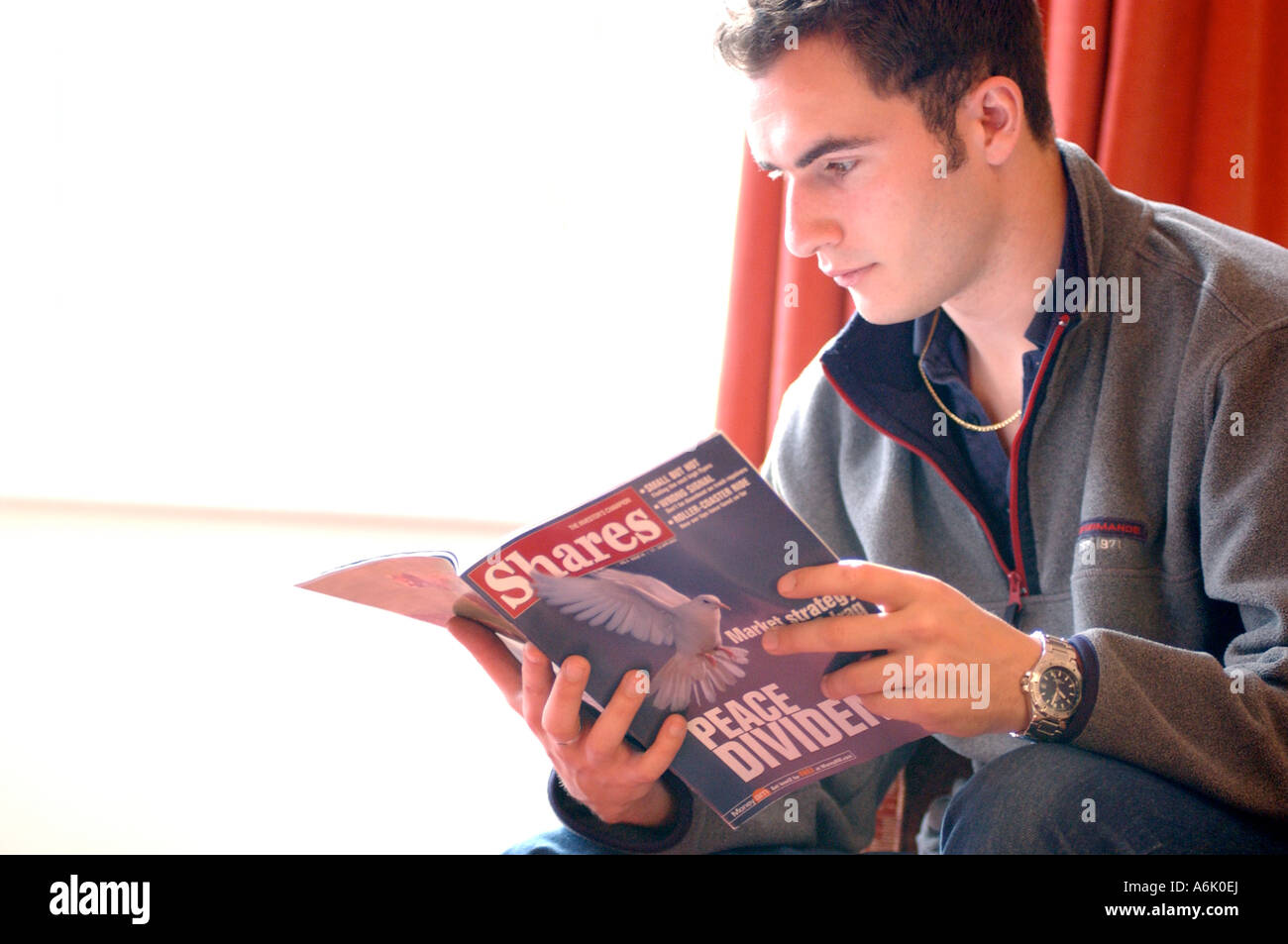 British business man reading financial magazine office London UK Stock ...