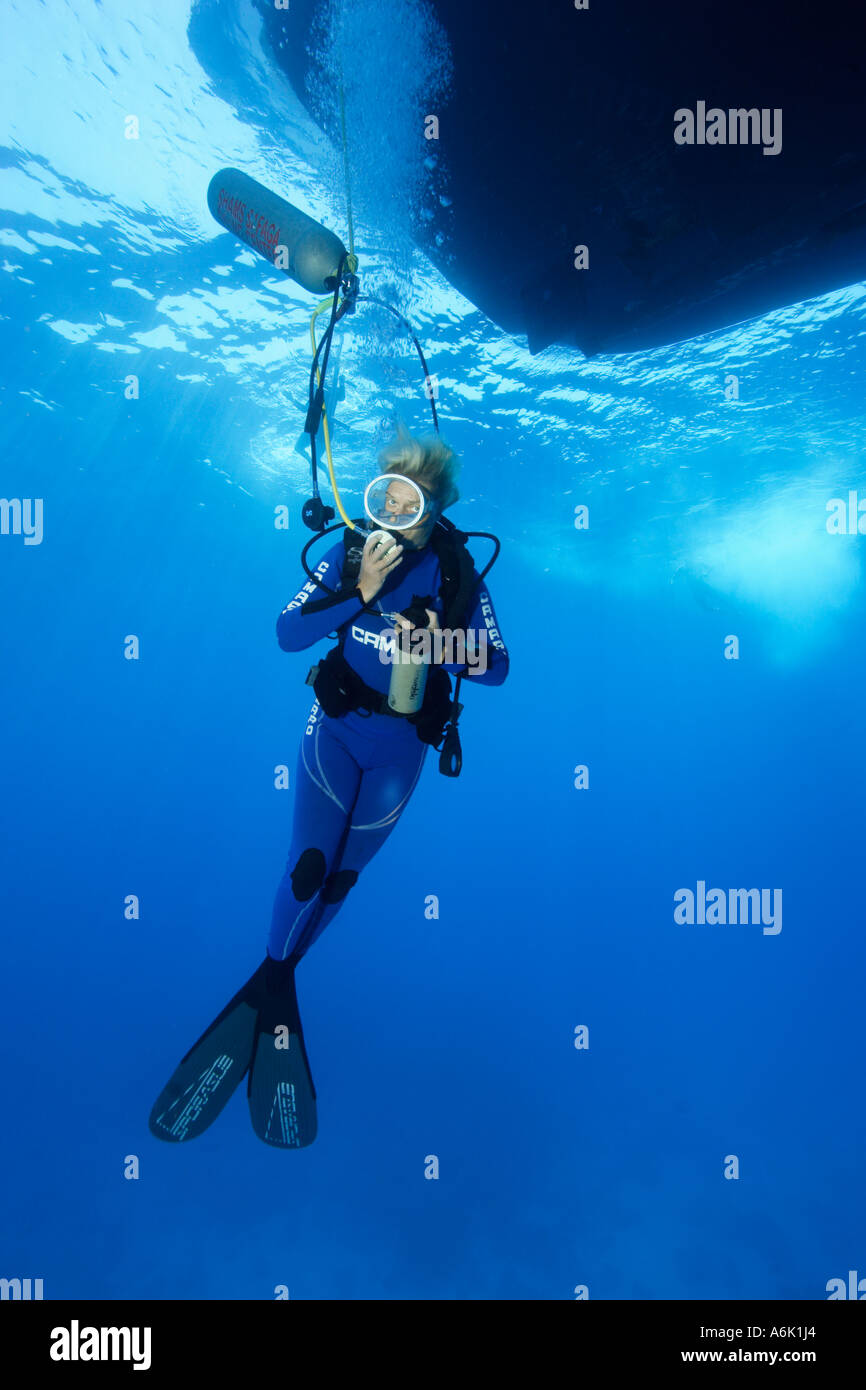 scuba diver with decompression tank under the dive boat Stock Photo - Alamy
