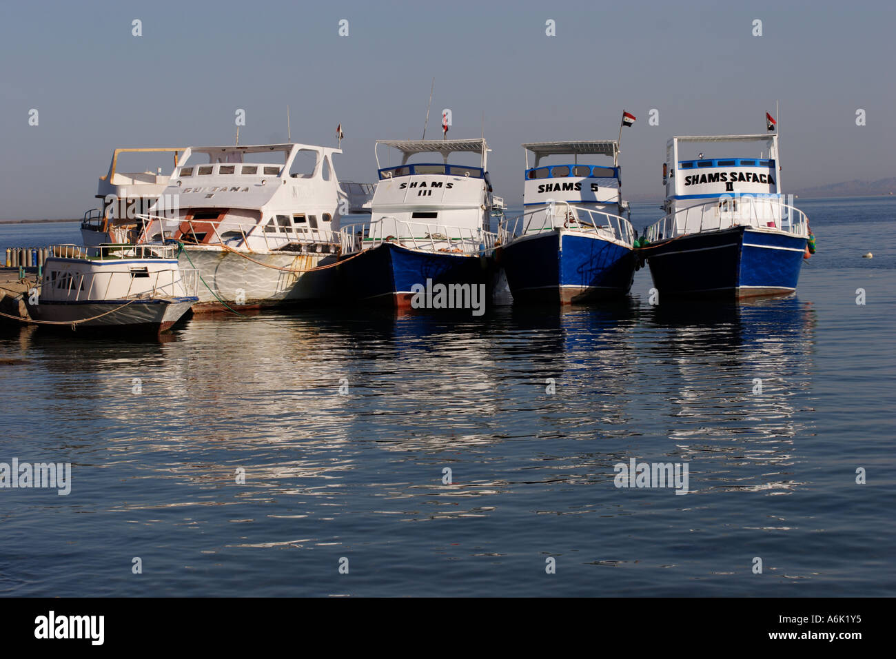 dive boats on the jetty Stock Photo - Alamy