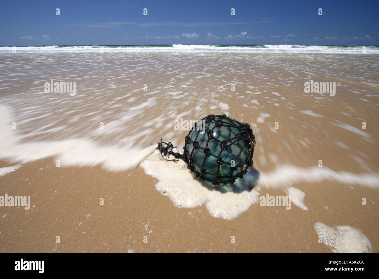 GLASS FLOAT WASHED UP ON BEACH HORIZONTAL BAPDB5817 Stock Photo - Alamy