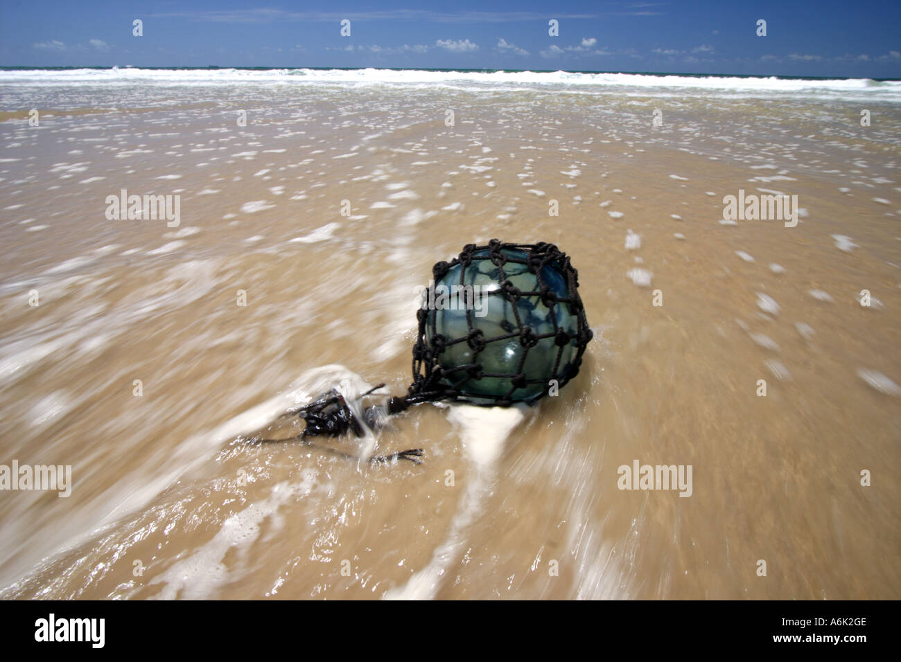 GLASS FLOAT WASHED UP ON BEACH HORIZONTAL BAPDB5818 Stock Photo - Alamy