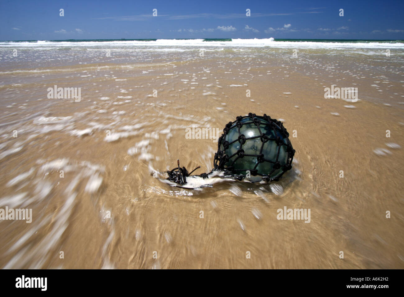 GLASS FLOAT WASHED UP ON BEACH HORIZONTAL BAPDB5819 Stock Photo - Alamy