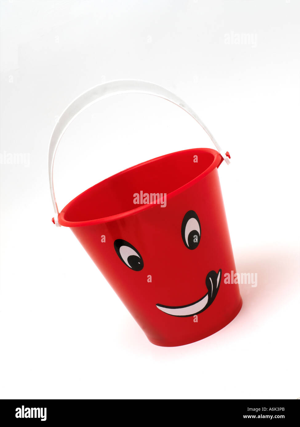 Childs Red Plastic Bucket with Smiley Face Stock Photo - Alamy