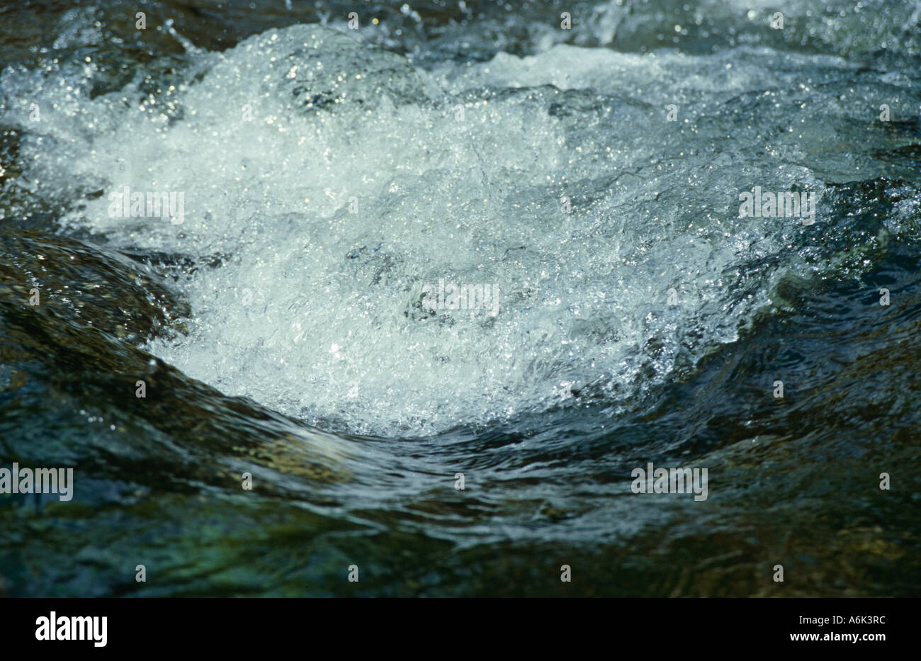 section of a river with a swift current Stock Photo - Alamy