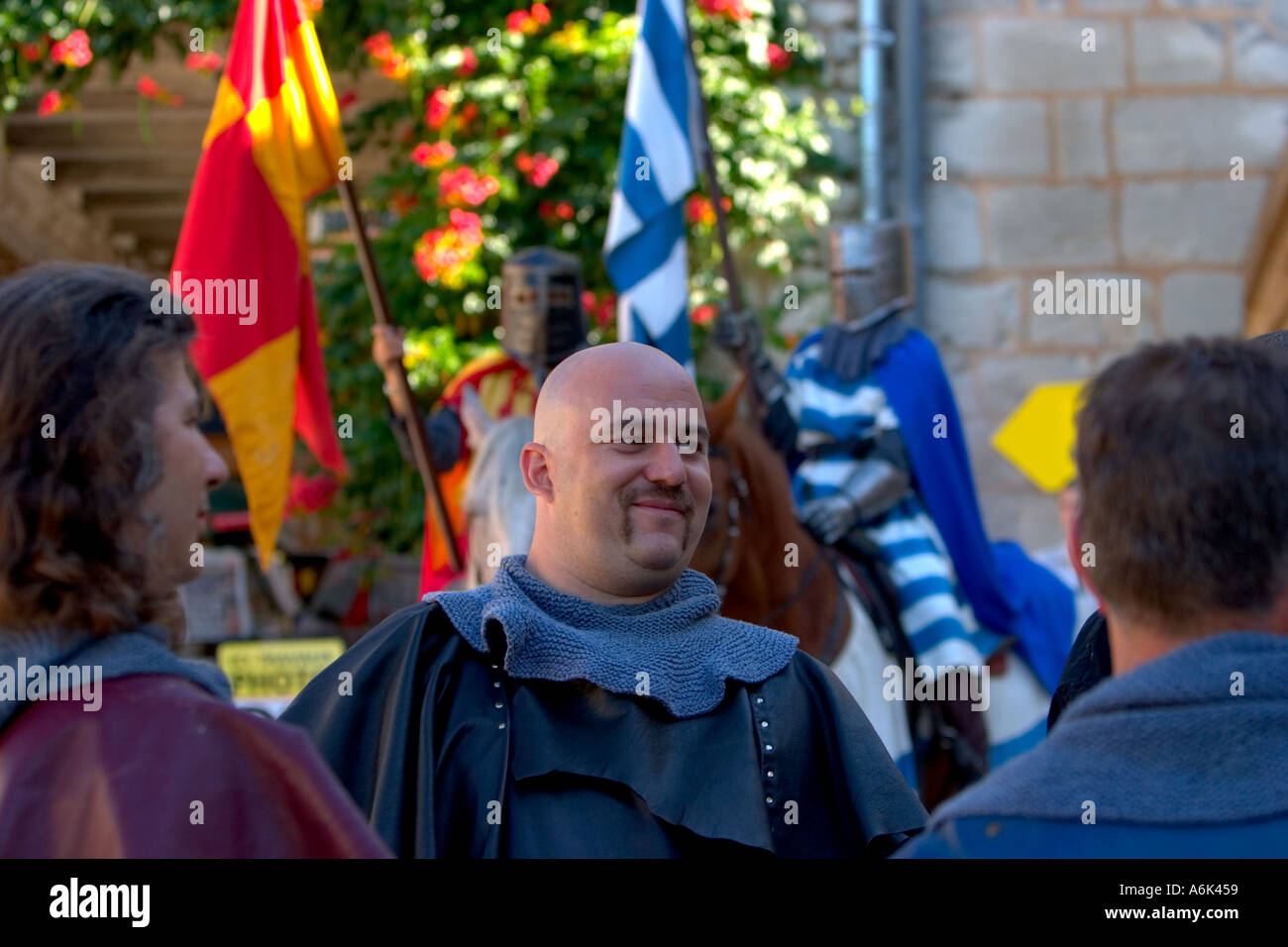 French knight in foreground with out of focus medieval knights on ...