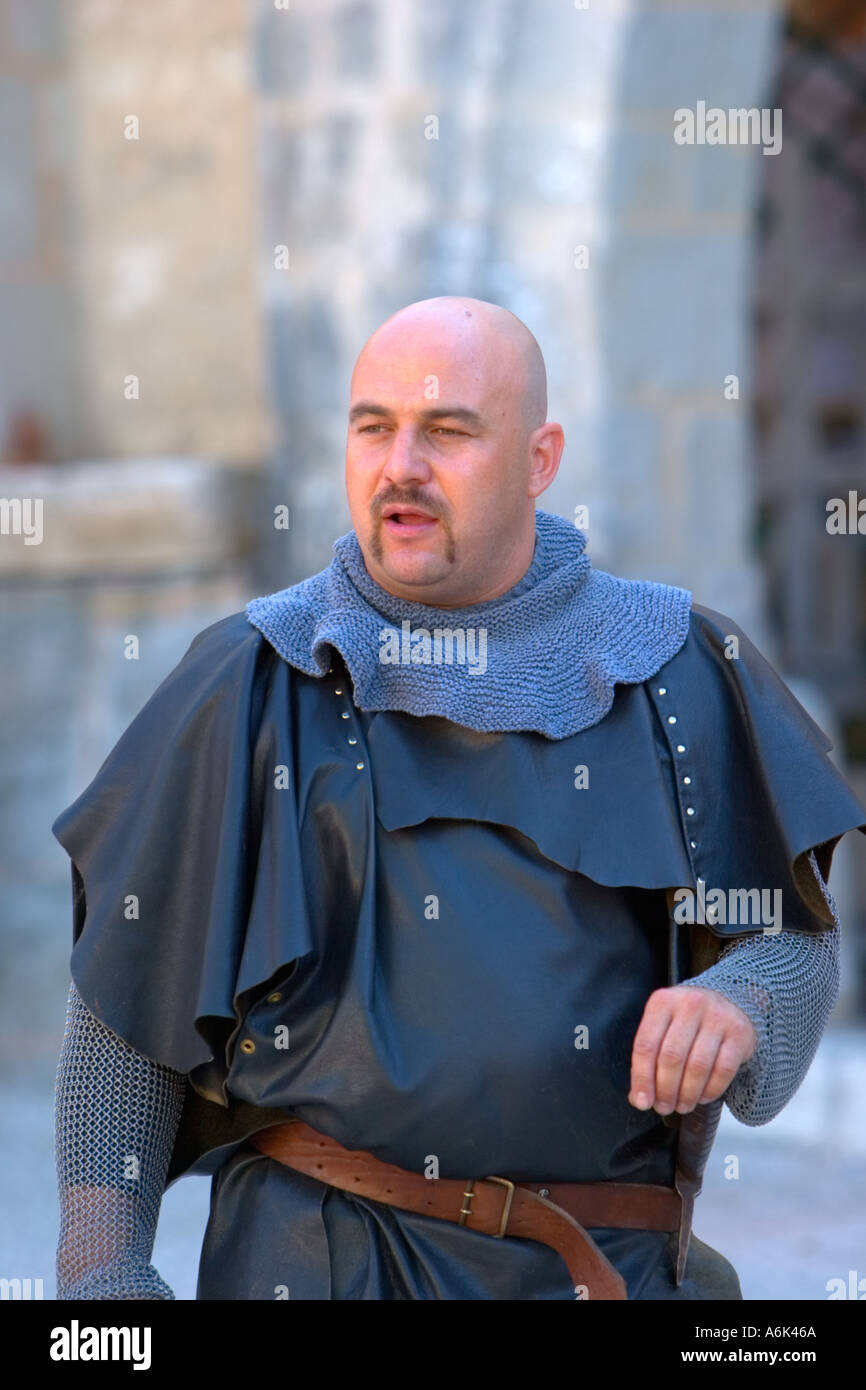 French medieval knight with bald head, wearing leather tunic and chain ...